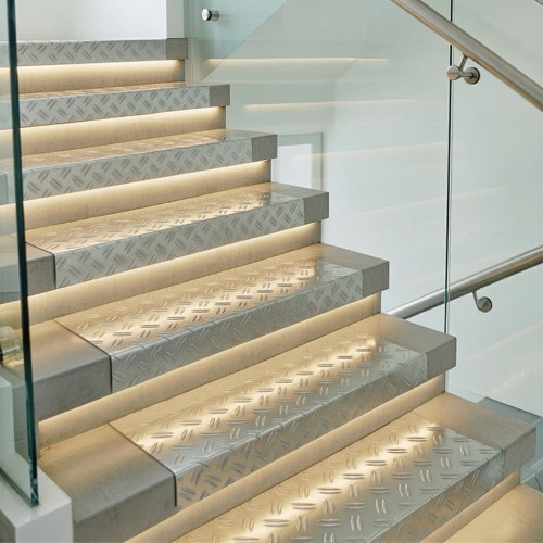 Custom-cut aluminum checker plate for stair treads